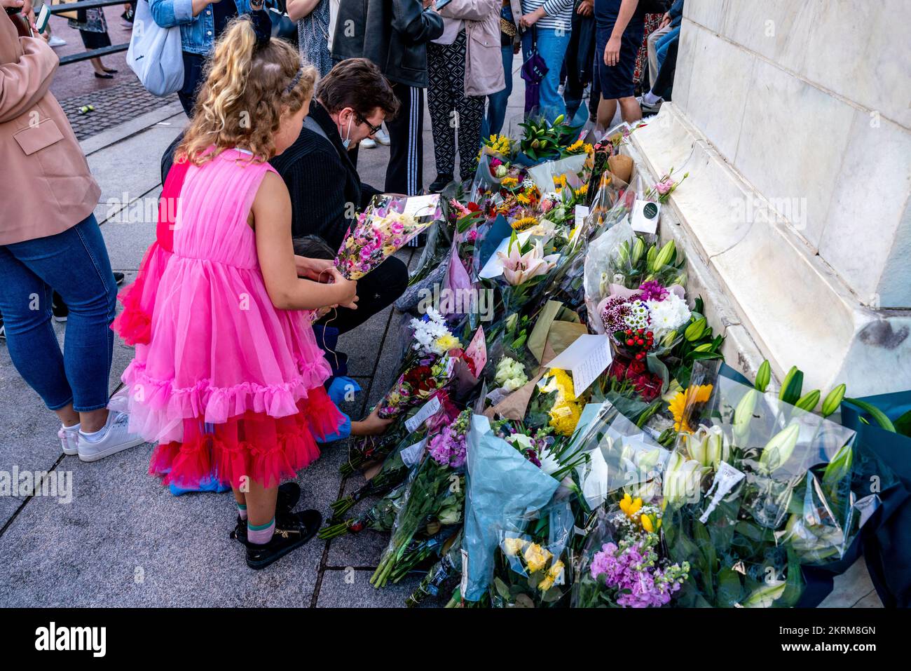 Children Laying Down Floral Tributes Opposite The Gates Of Buckingham ...