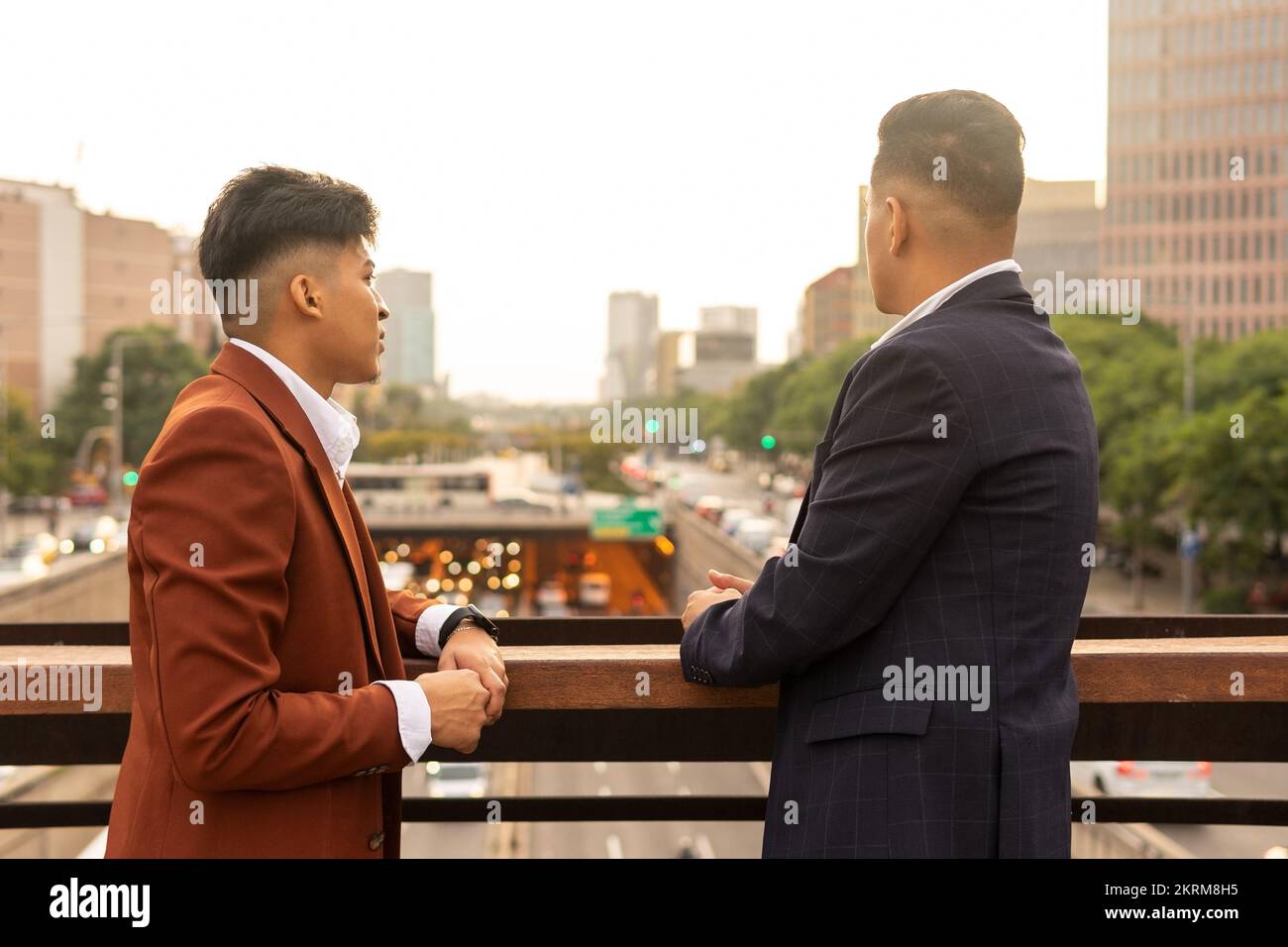 Side view of Hispanic well dressed men having pleasant conversation ...