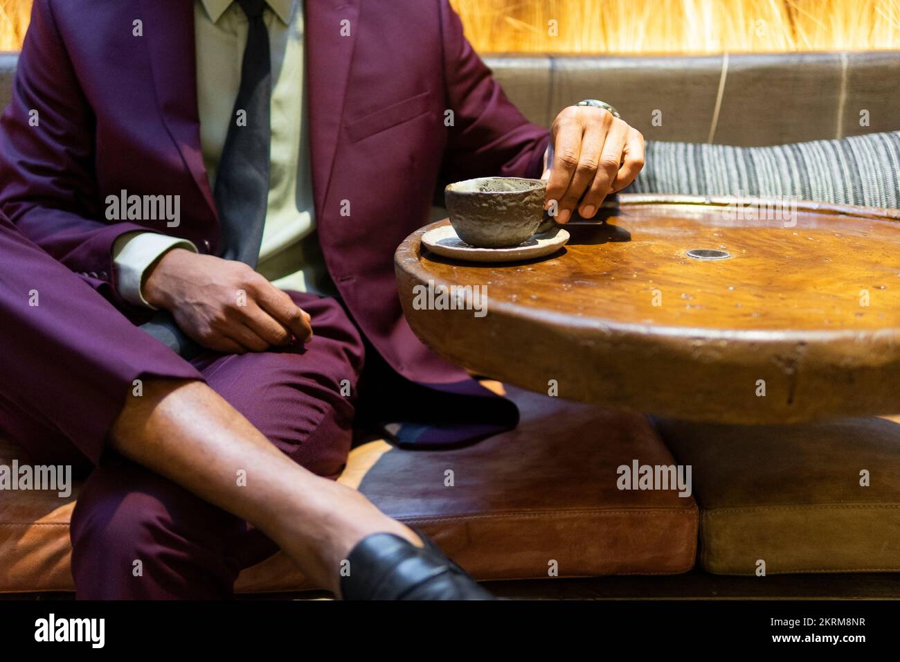 Stylish cropped unrecognizable African American male freelancer in suit ...