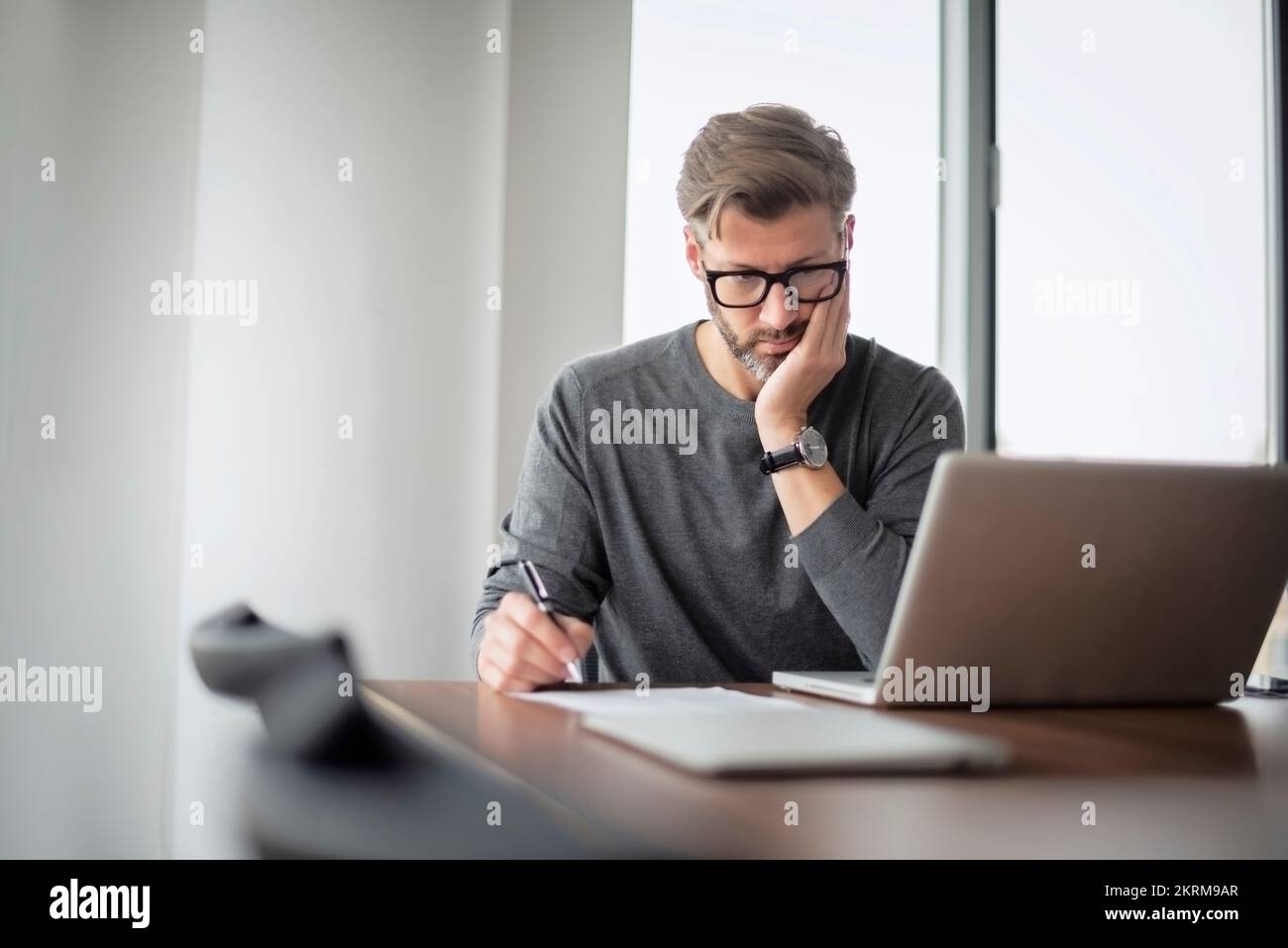 Mature adult man writing doing hi-res stock photography and images - Alamy