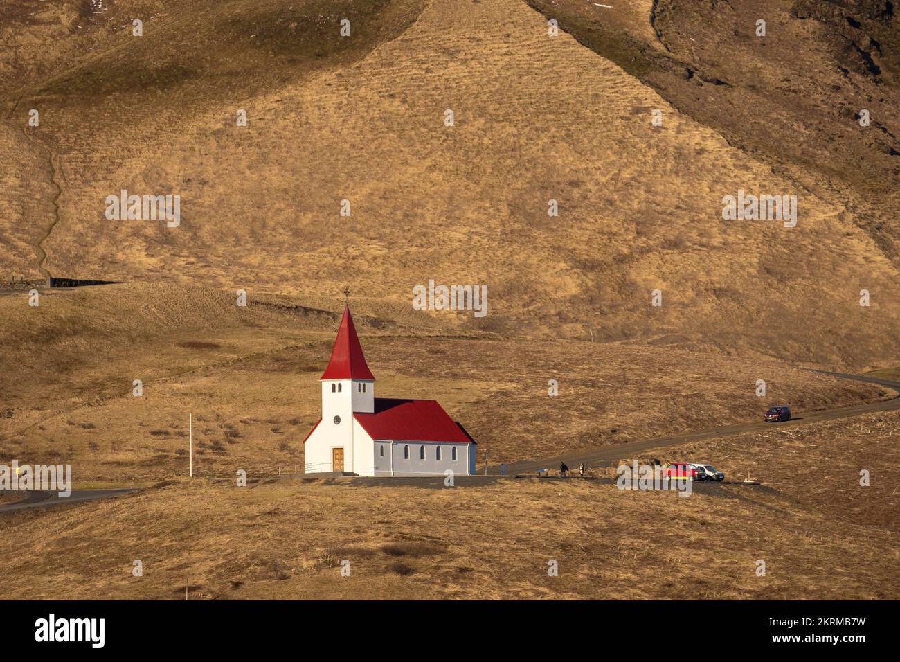 Reyniskyrka church located on grassy hill in countryside on sunny day ...