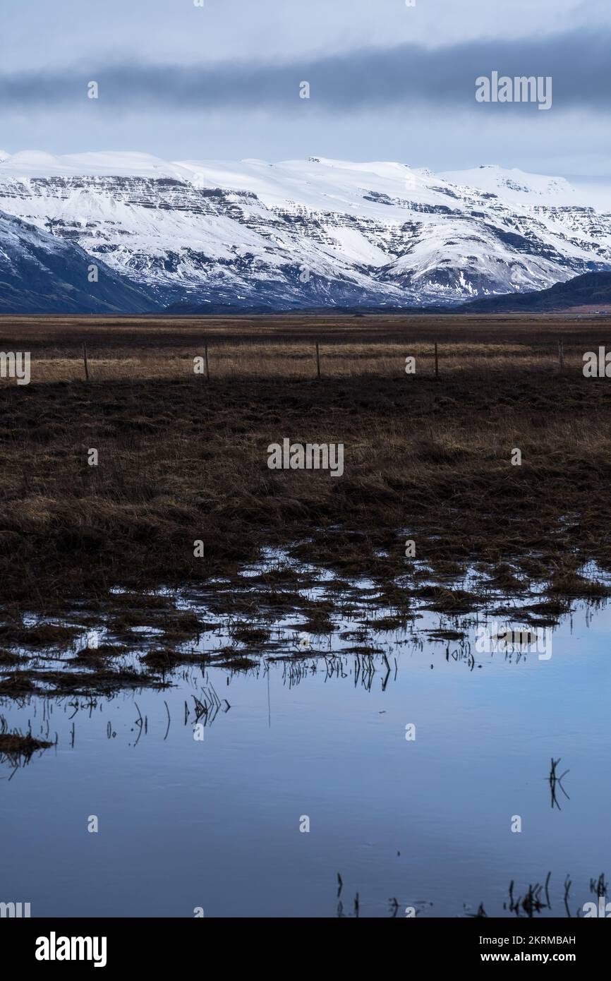 Melted snow among high spectacular breathtaking mountains covered with ...