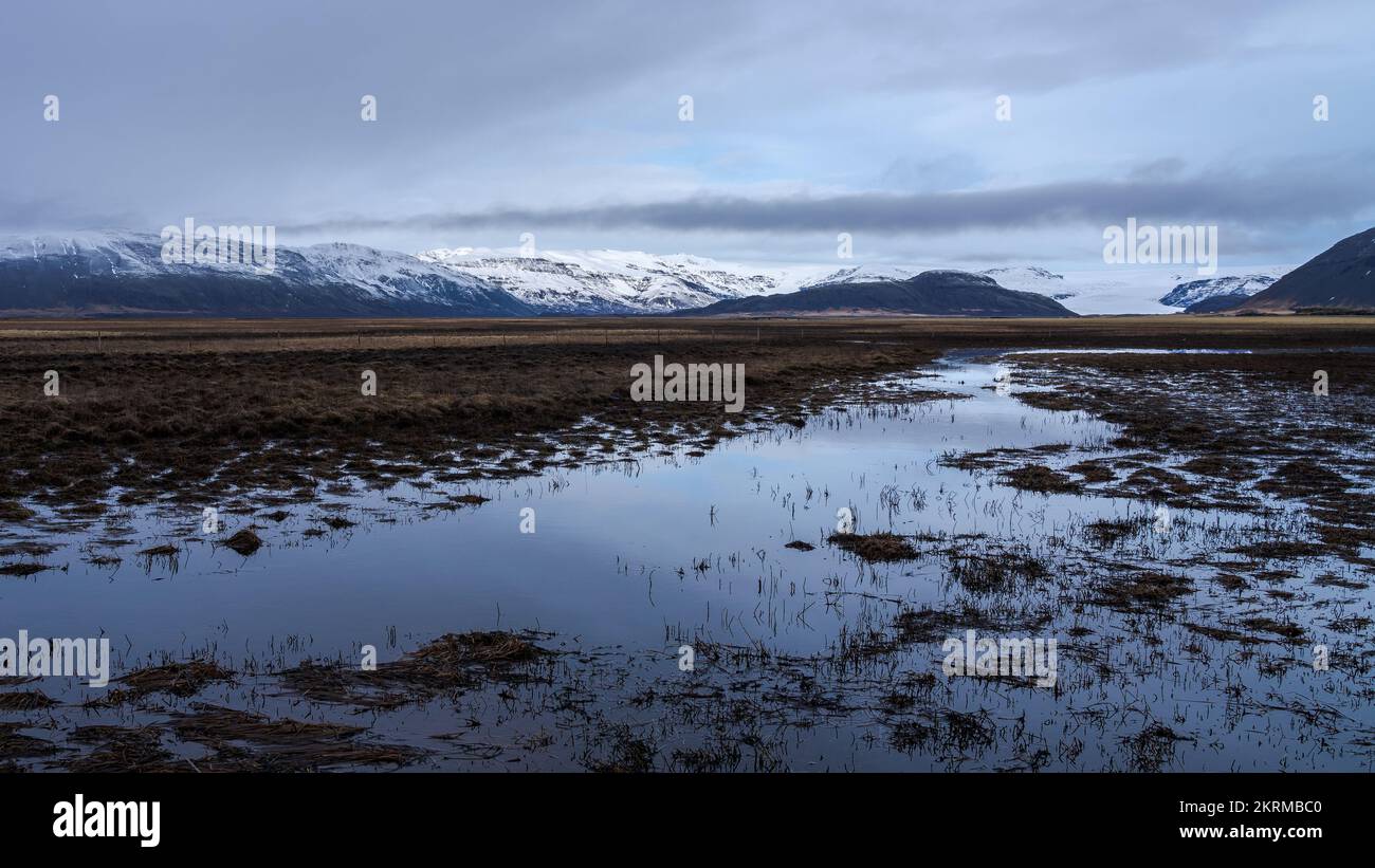 Melted snow among high spectacular breathtaking mountains covered with ...
