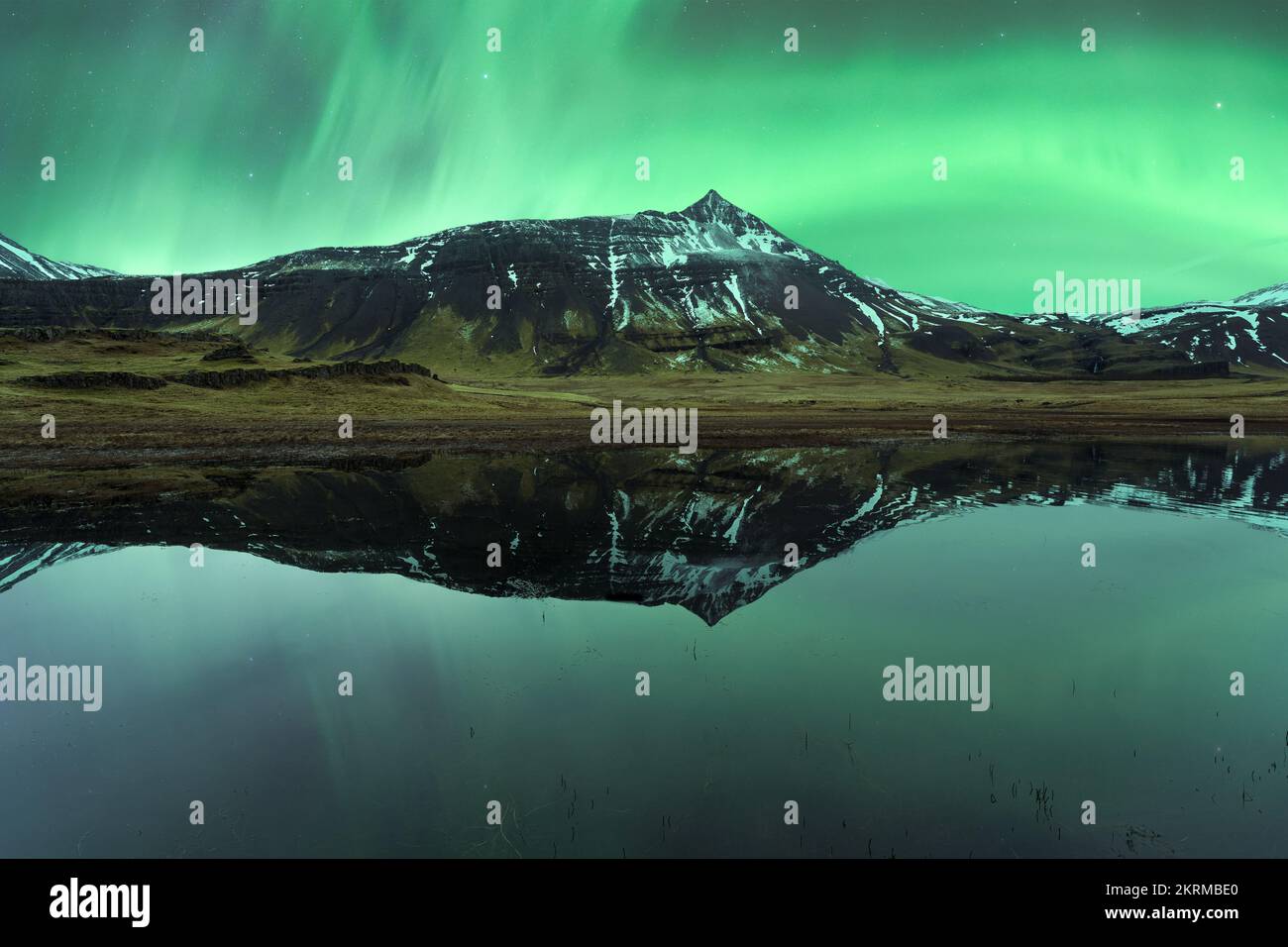 Breathtaking view of mountains covered with snow near crystal clean ...