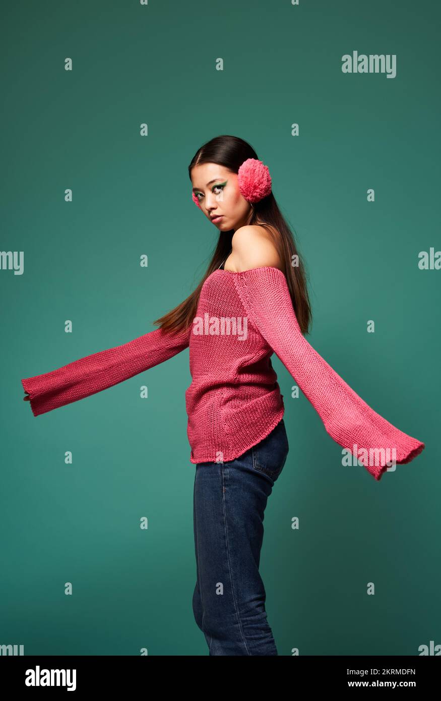 Portrait side view of young Filipino female model in stylish outfit and ...
