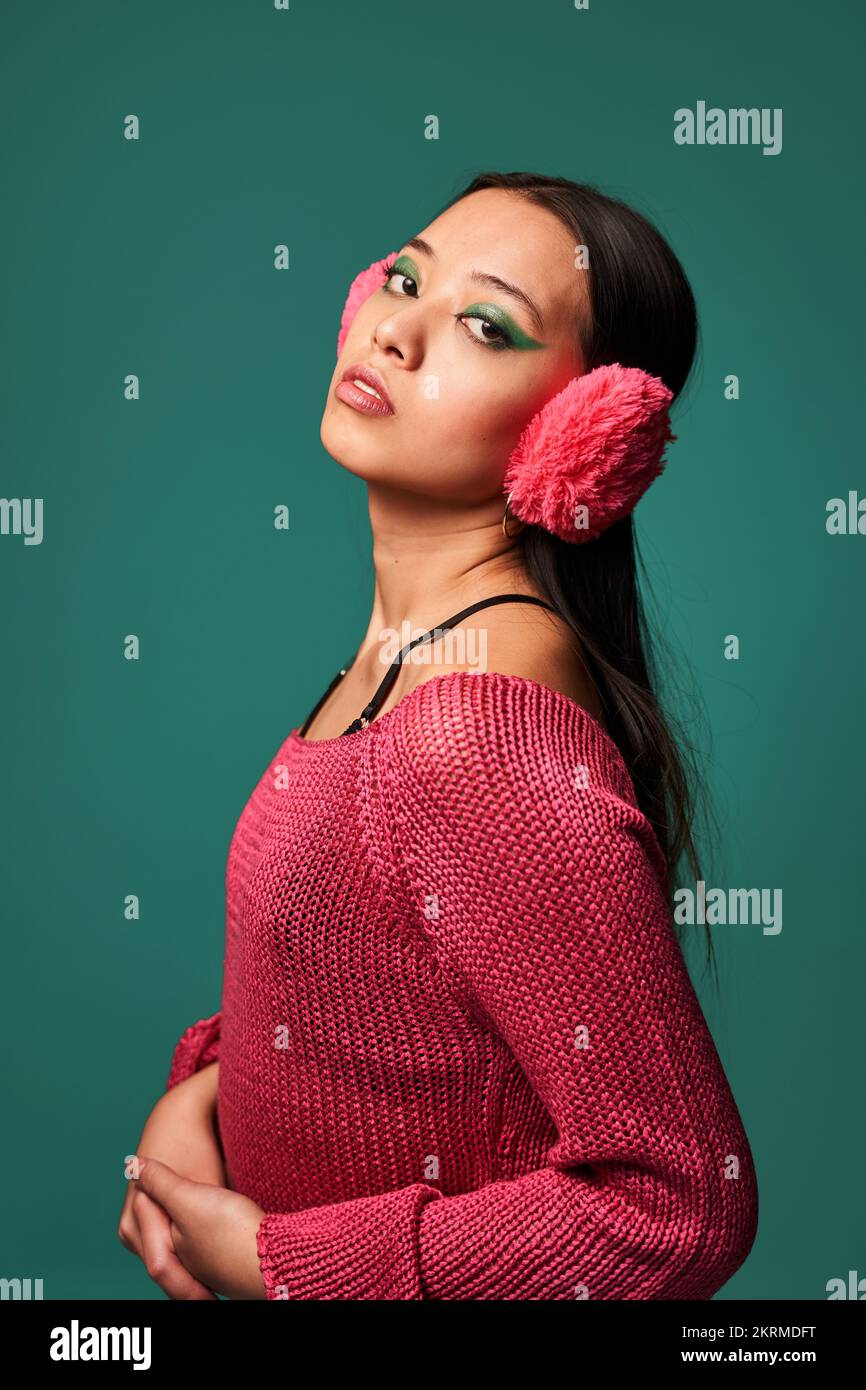 Portrait side view of young Filipino female model in stylish outfit and ...