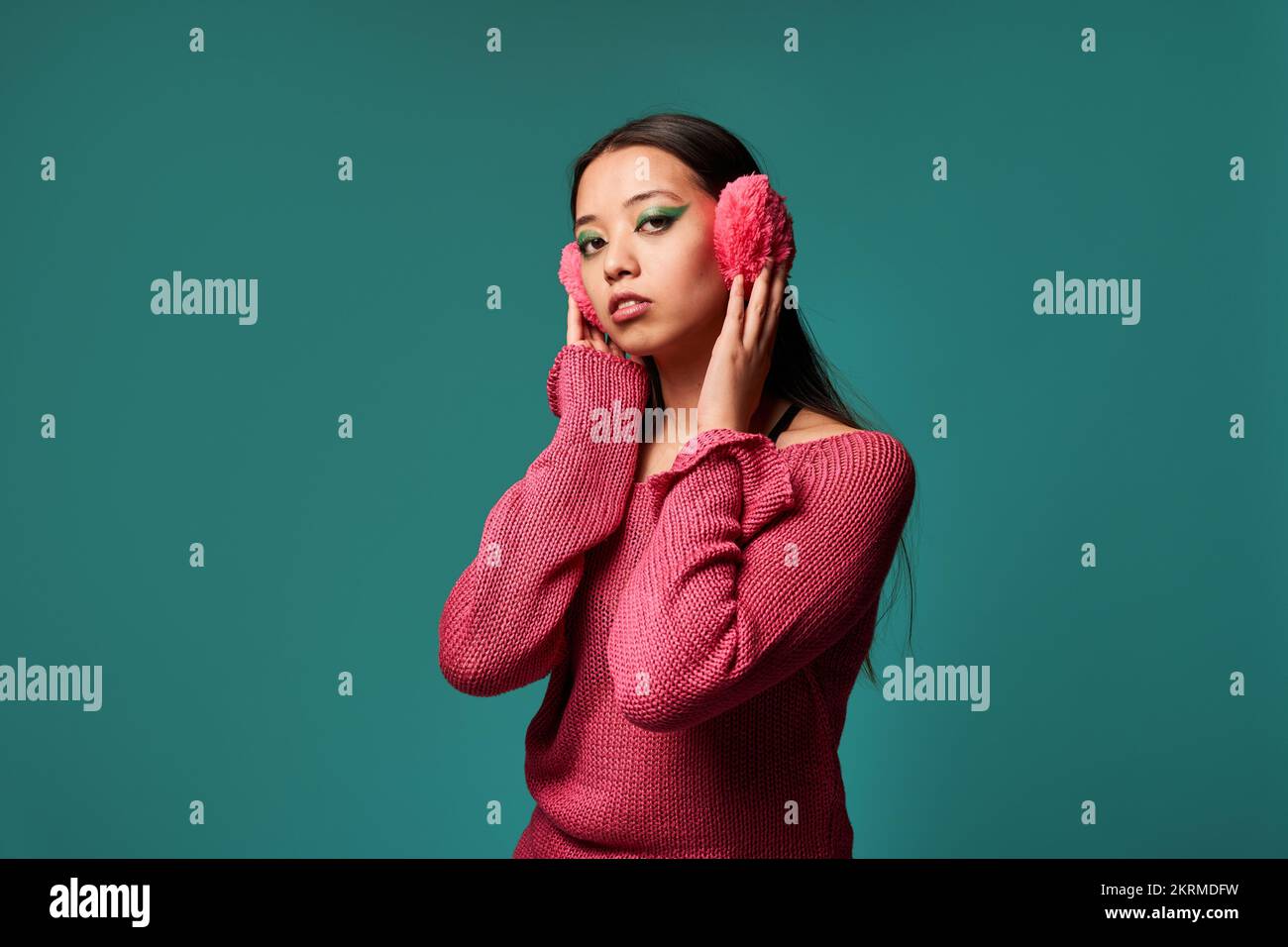 Portrait side view of young Filipino female model in stylish outfit and ...