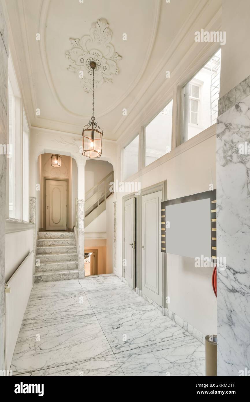 Long corridor with doors and marble floor and various decorative frames ...