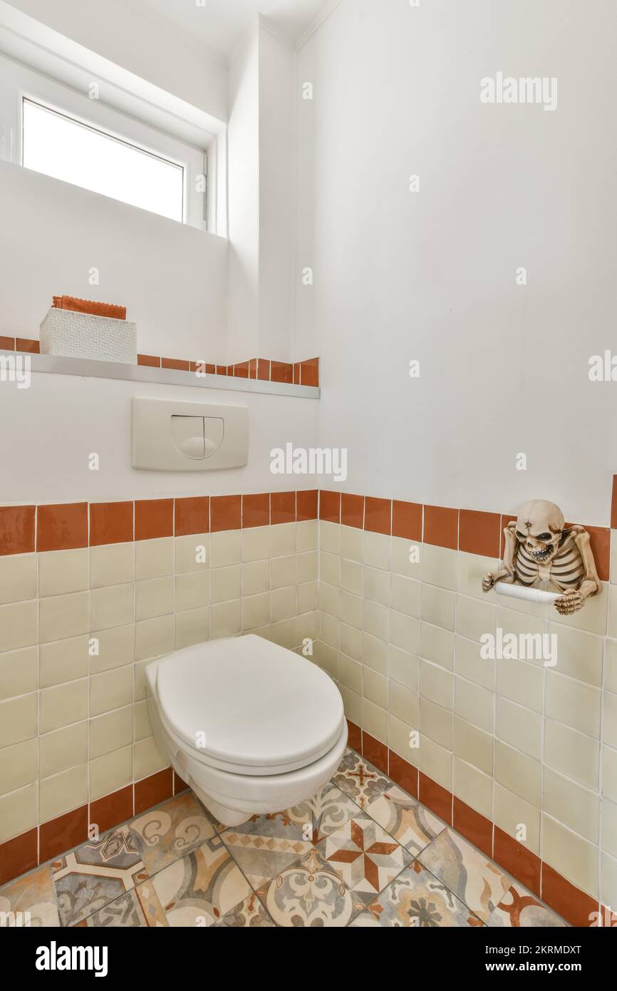 Ceramic toilet bowl in light restroom with azulejo tiles in modern ...