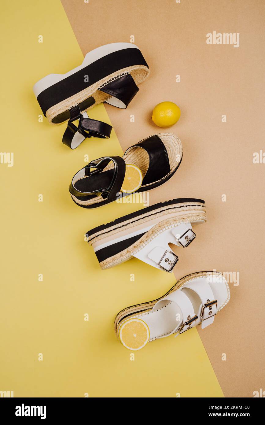 Top view composition of various wicker platform sandals placed on ...