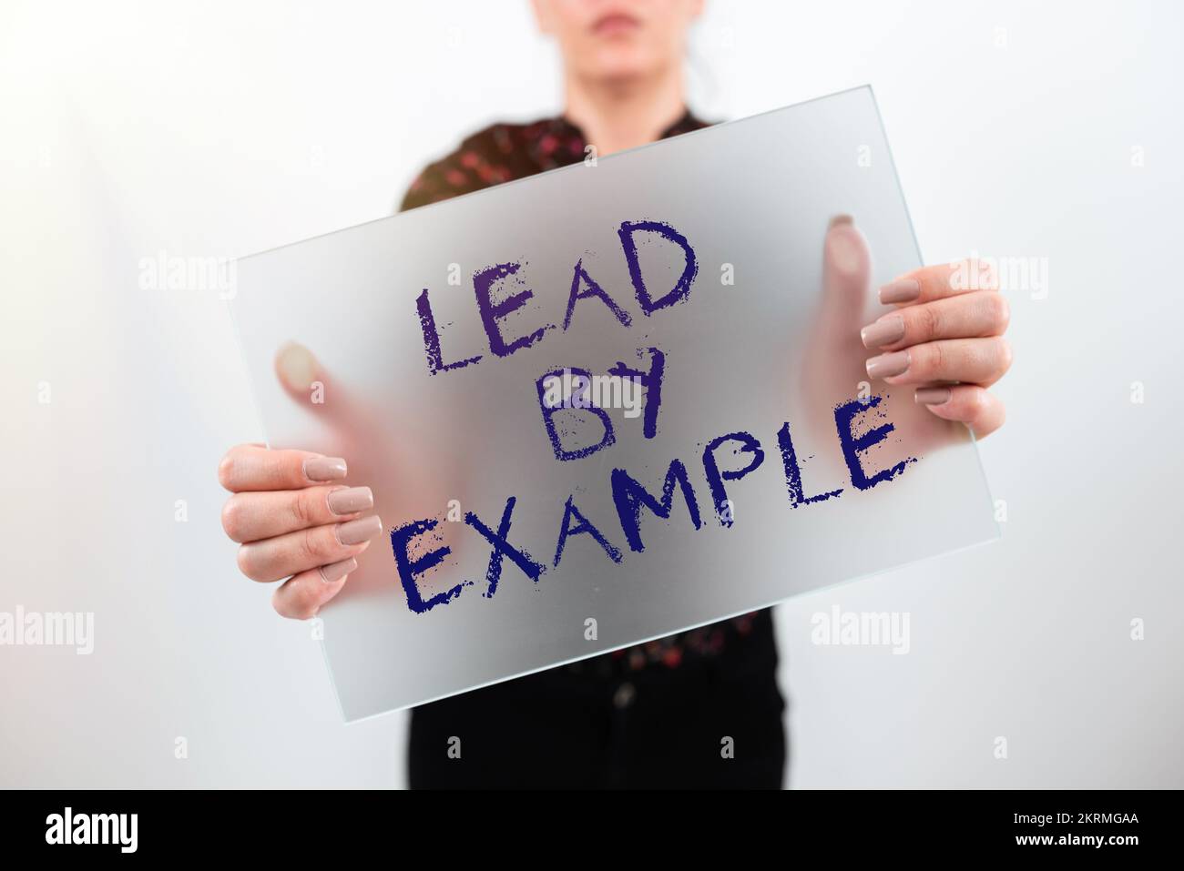 Sign displaying Lead By Example, Conceptual photo Leadership Management ...