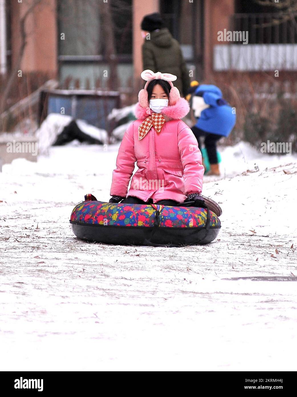 Children play with snow after the cold wave attack in Harbin City ...