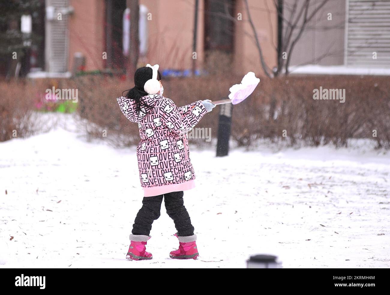 Children play with snow after the cold wave attack in Harbin City ...