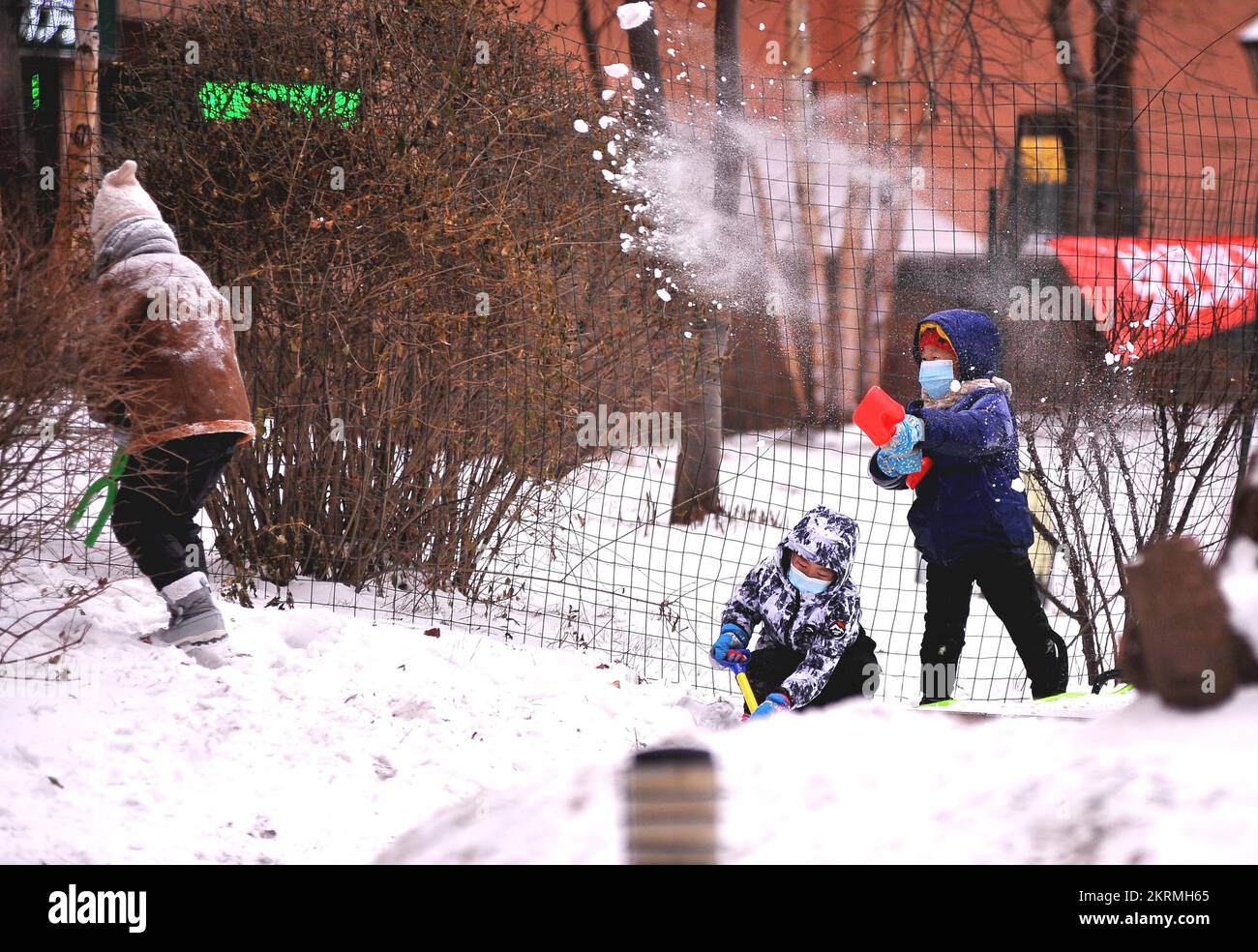 Children play with snow after the cold wave attack in Harbin City ...