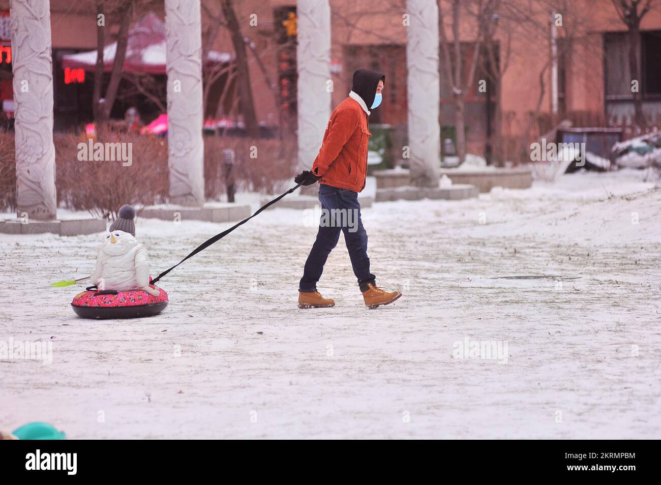 Children play with snow after the cold wave attack in Harbin City ...