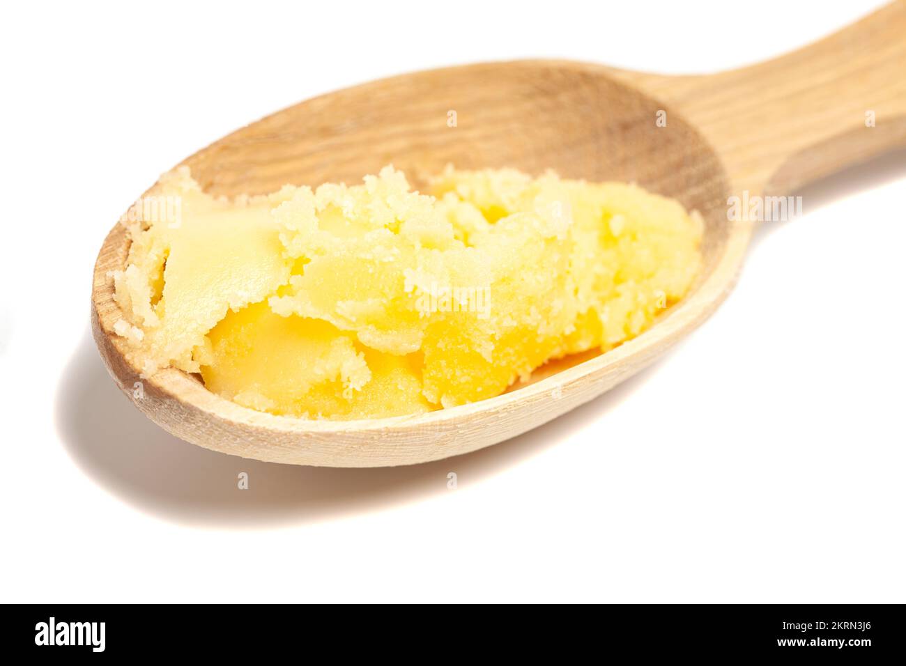 Ghee in wooden spoon isolated on white background,top view Stock Photo ...