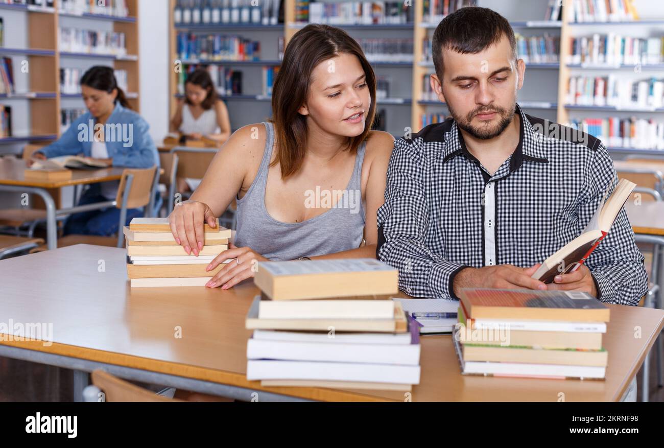 Students studying in library Stock Photo - Alamy
