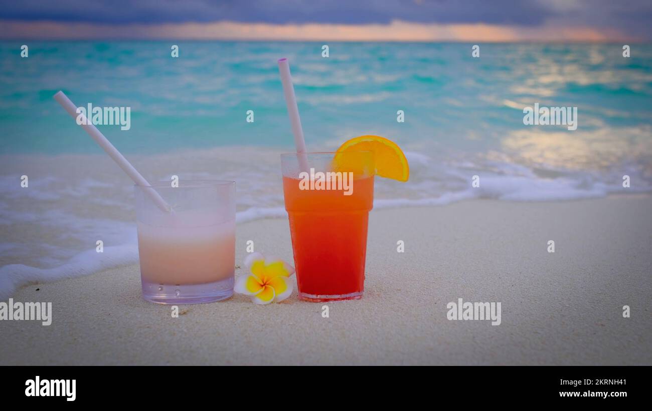 Close up of hands with cocktails making a toast Stock Photo - Alamy