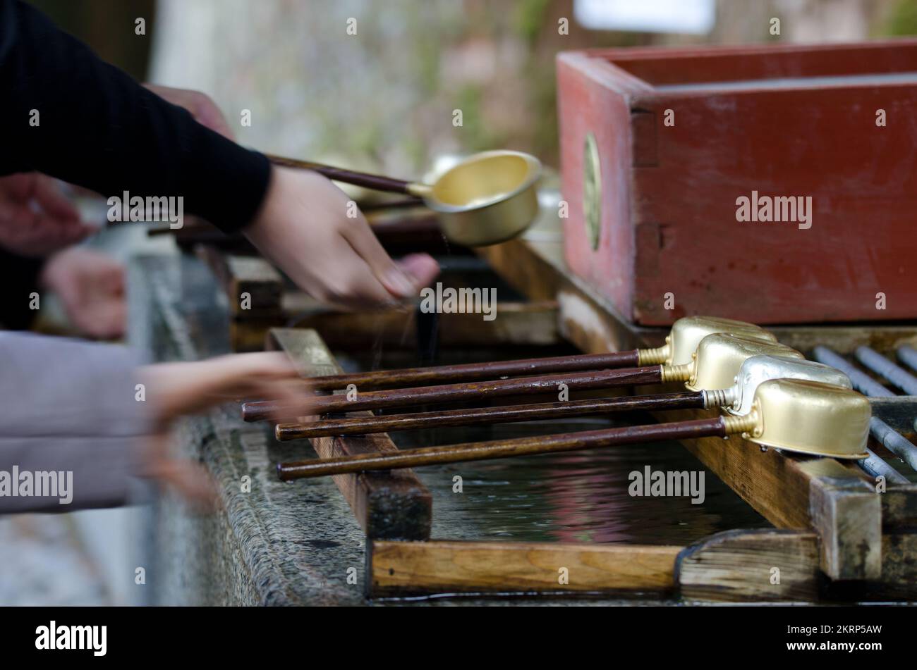 People performing ablutions, ceremonial purification rite known as ...