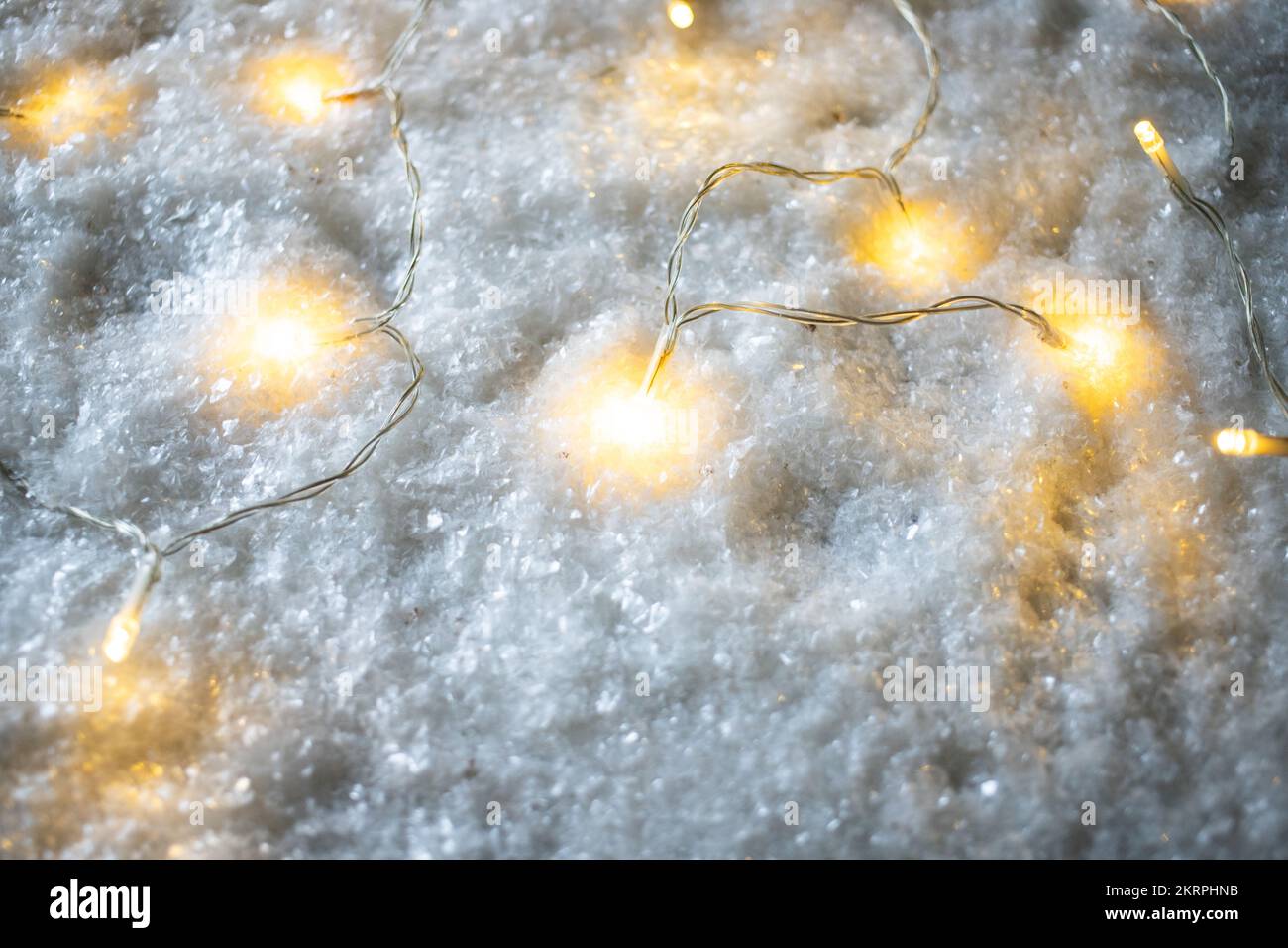 christmas string lights in snow Stock Photo - Alamy