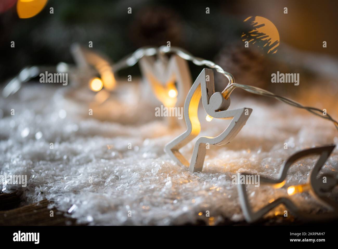 christmas string lights in snow Stock Photo - Alamy