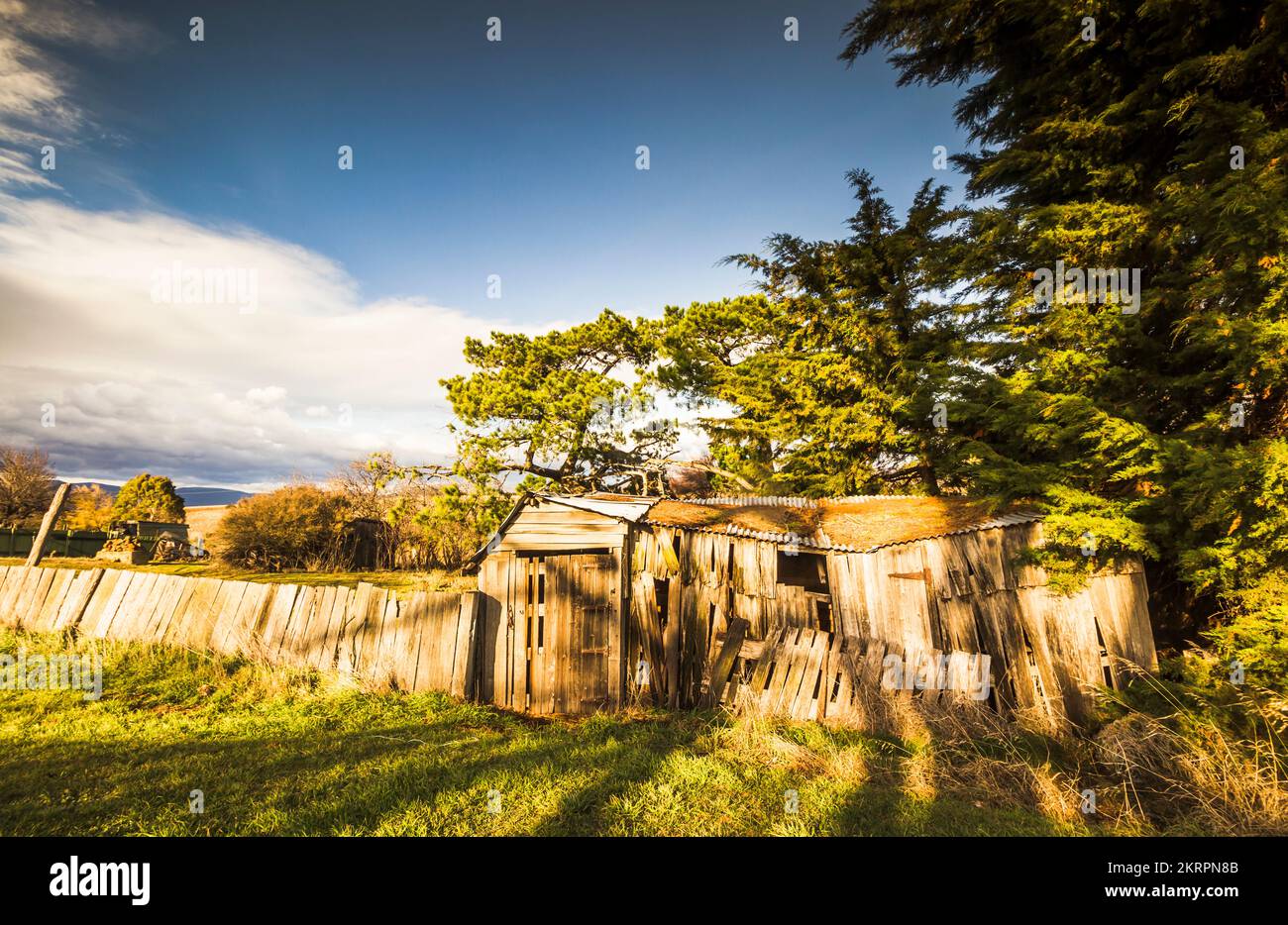 Remote landscaped scenery of an old ramshackle wooden shack in green ...