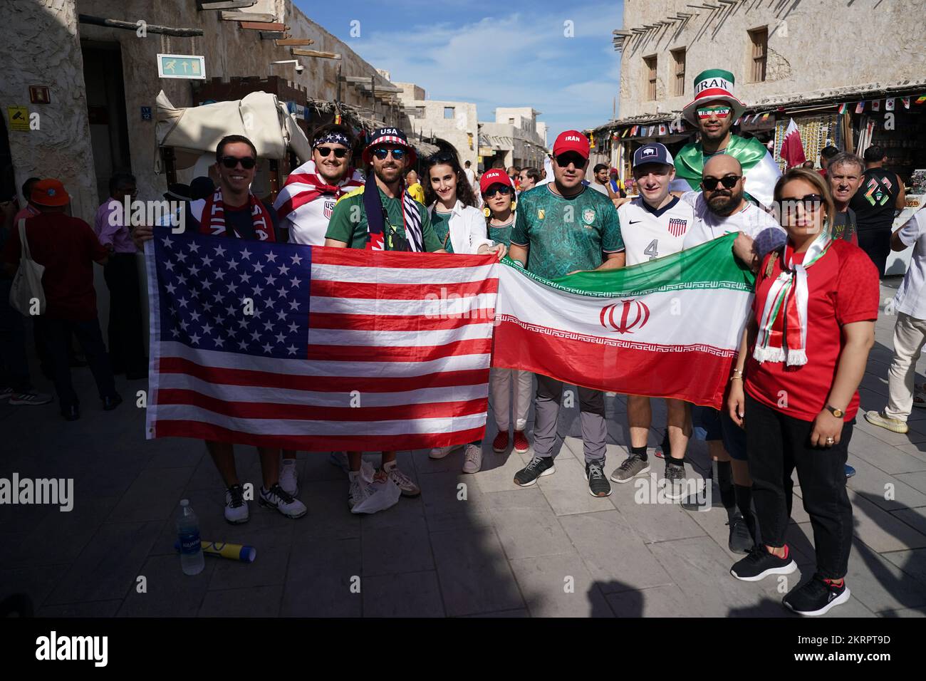USA and Iran fans pose for a photograph at the souq in Doha before a ...