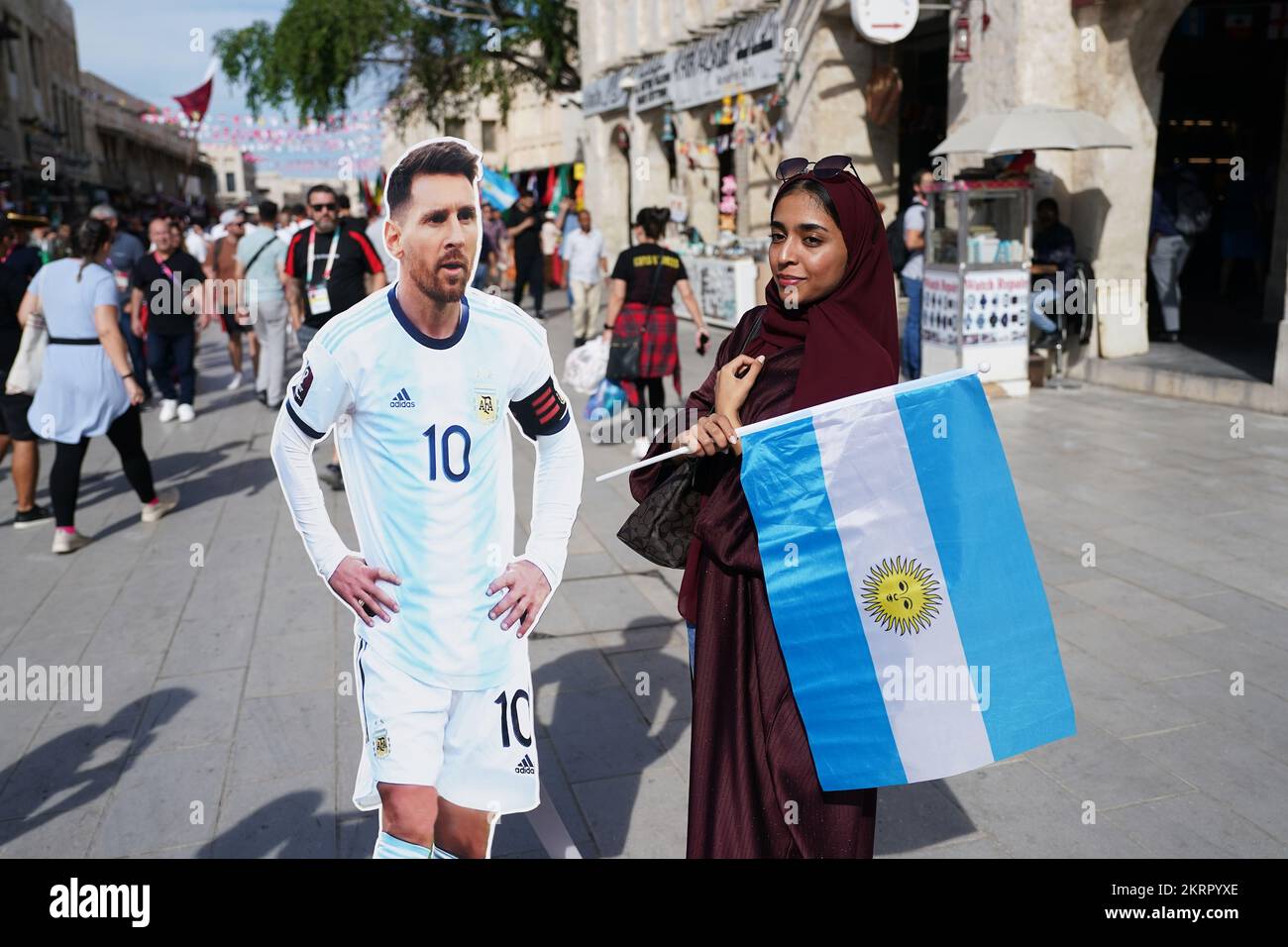 A fan poses for a photograph with a cardboard cut-out of Argentina's ...