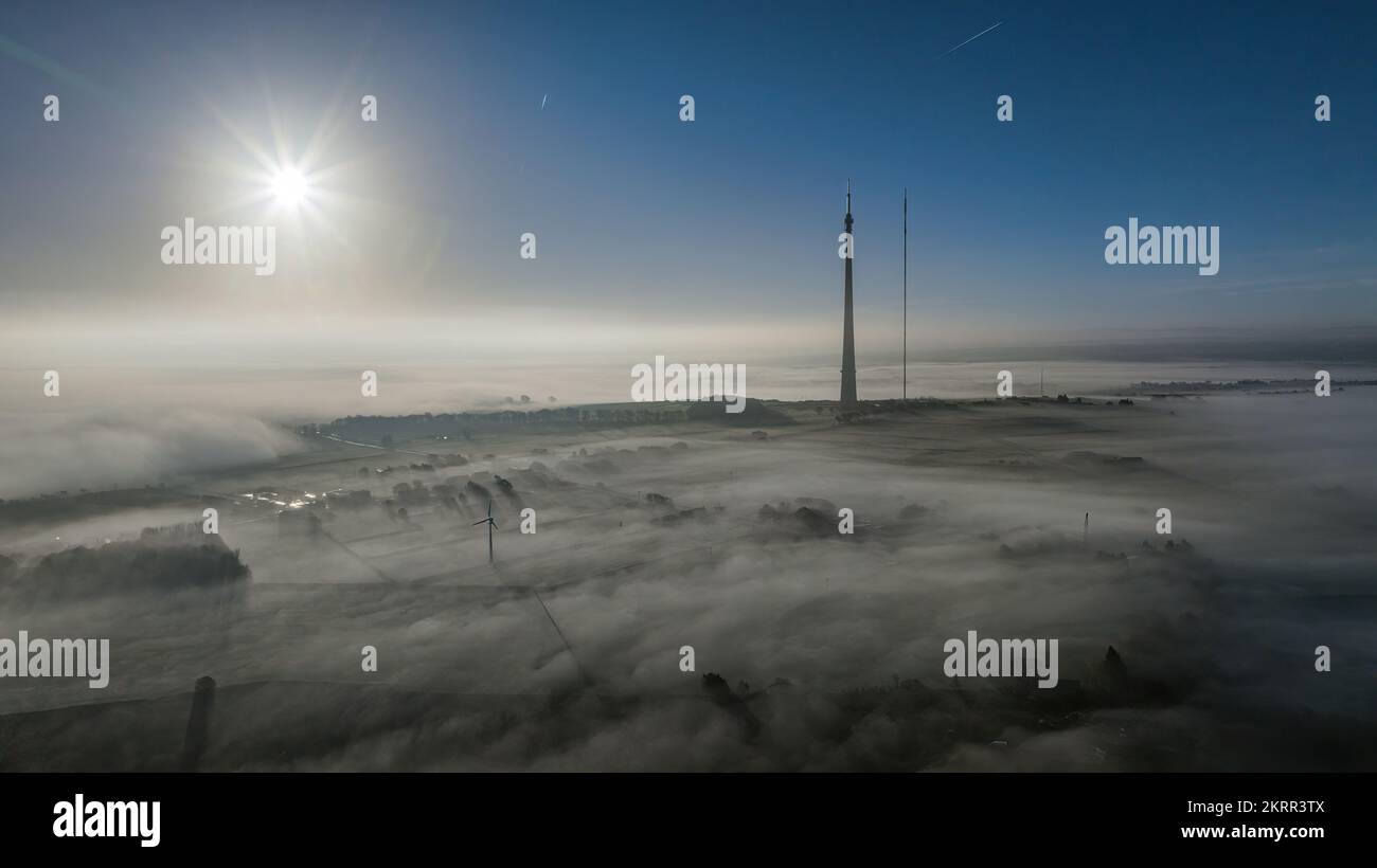 The Sun rises at Emley Moor Transmitting Tower as blanket of heavy Fog ...