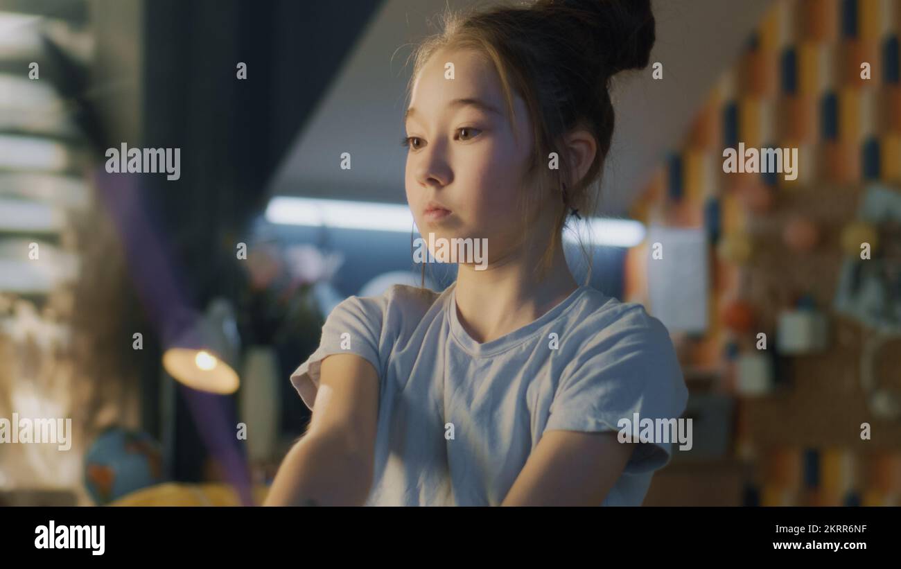 Young asian girl spins gymnastic bar around herself, and trains new ...