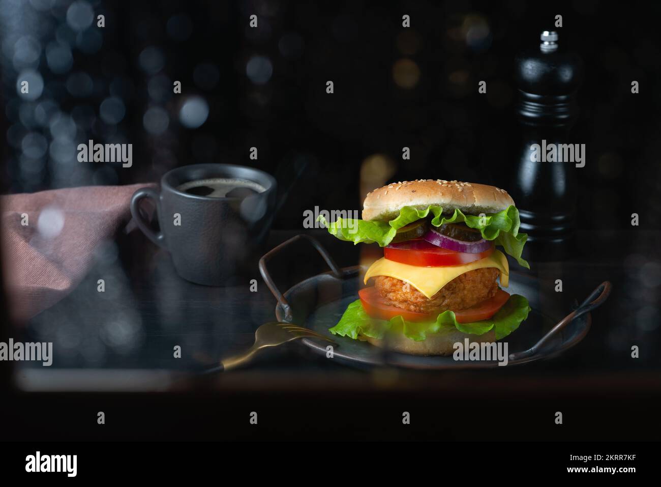 View of a table in a cafe with a burger through the window Stock Photo ...