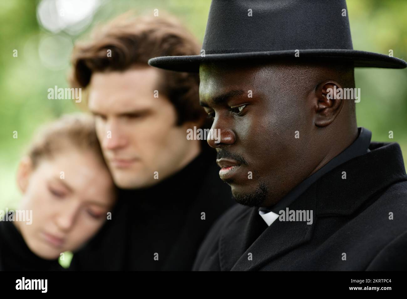 Side view portrait of African American priest holding ceremony at ...