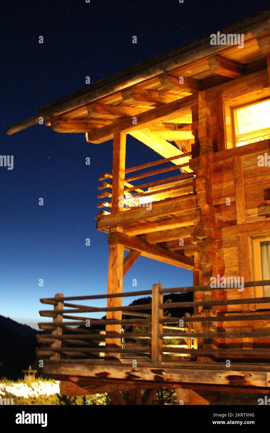 Wooden Swiss Chalet lit up at night (Verbier, Switzerland Stock Photo ...
