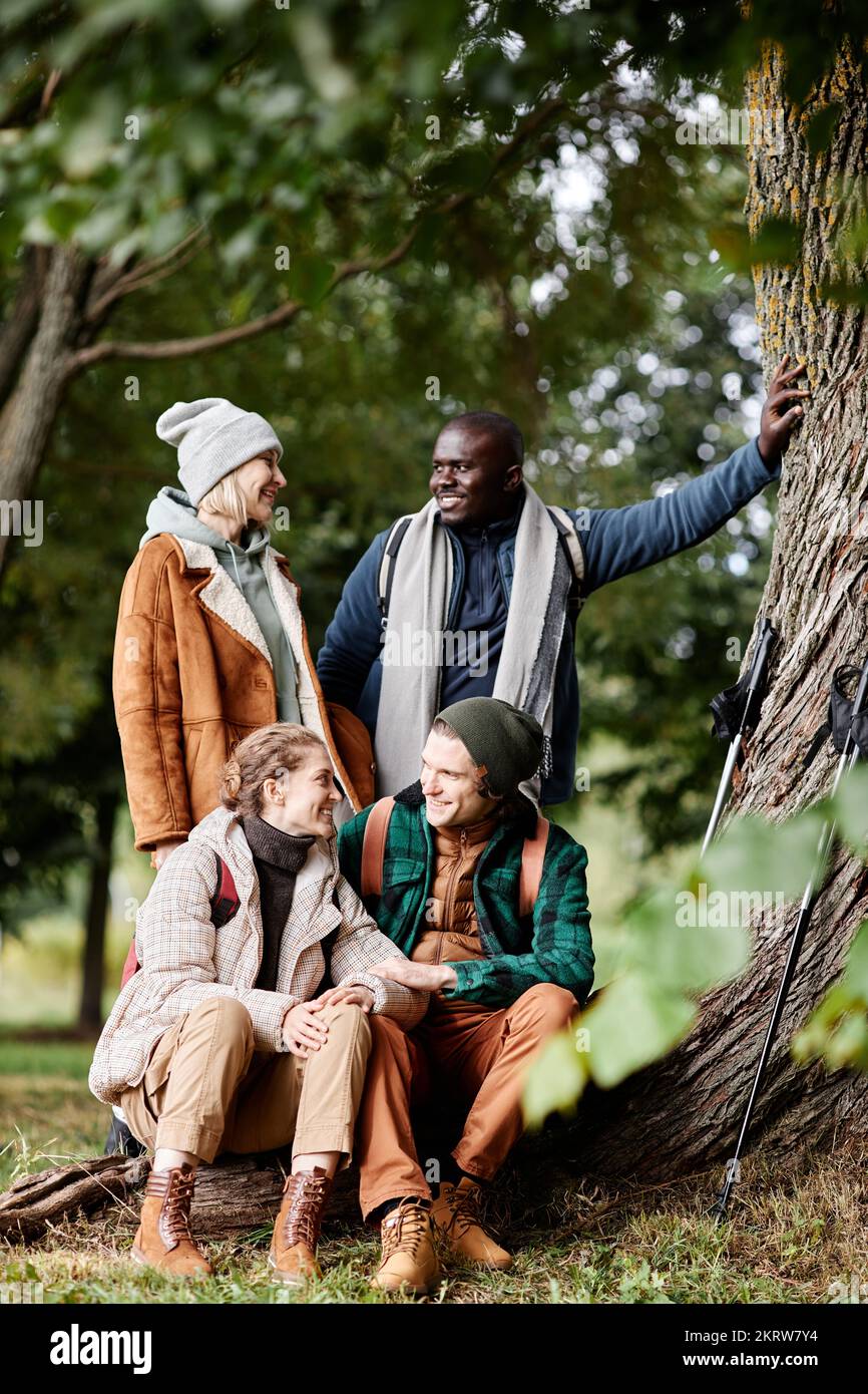 Diverse group of four friends enjoying hike in forest Stock Photo - Alamy
