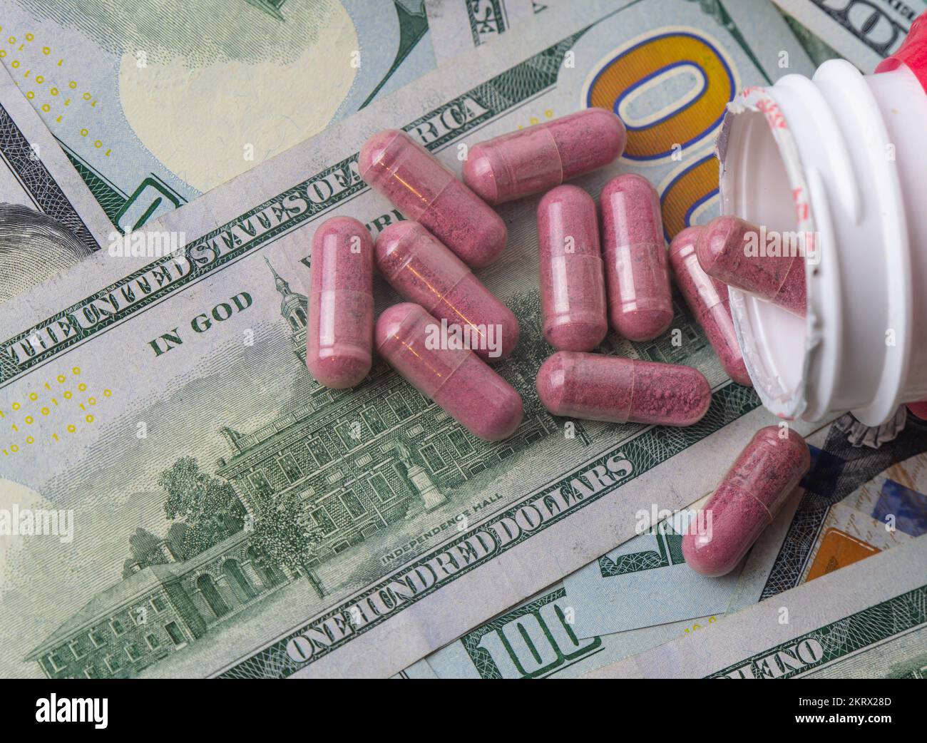red pills on background of cash money, drug industry concept Stock ...