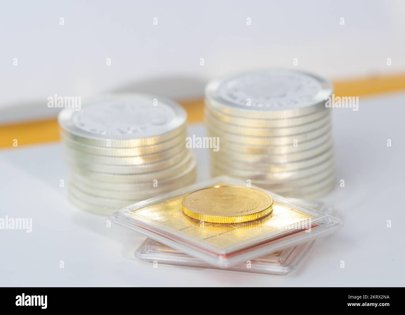 Home savings in gold silver and cash Stock Photo - Alamy