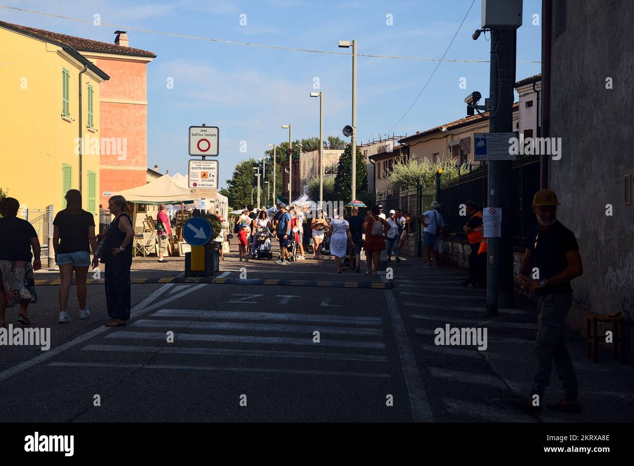 Stalls and crowd of a fair in the italian countryside in summer Stock ...