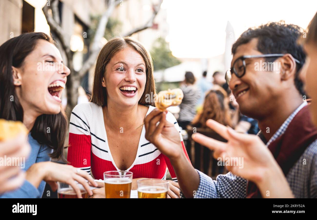 Happy toothy smiling young woman at brewery with friends, generation z ...