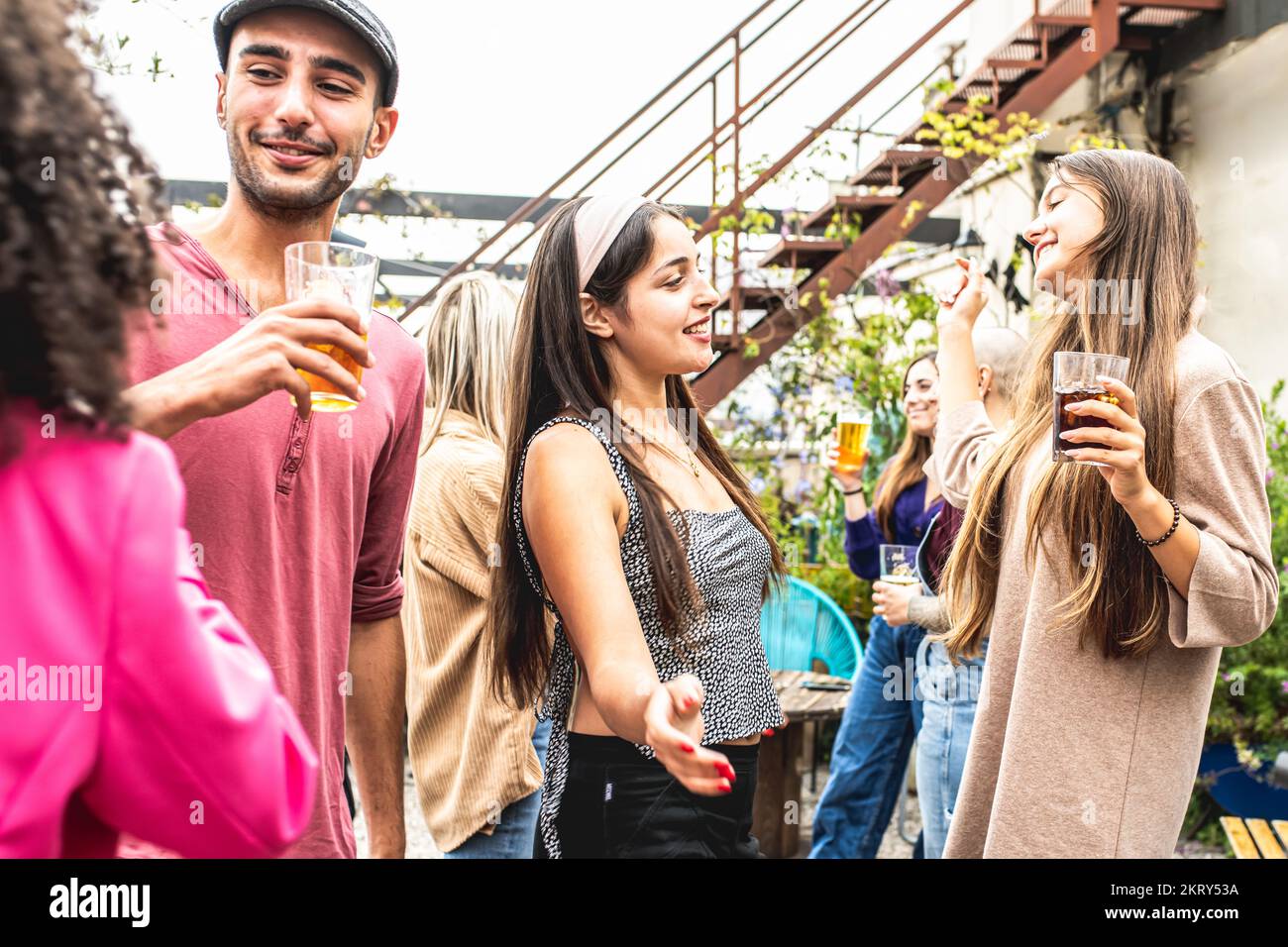 rooftop dancing party of young people, young generation females and ...