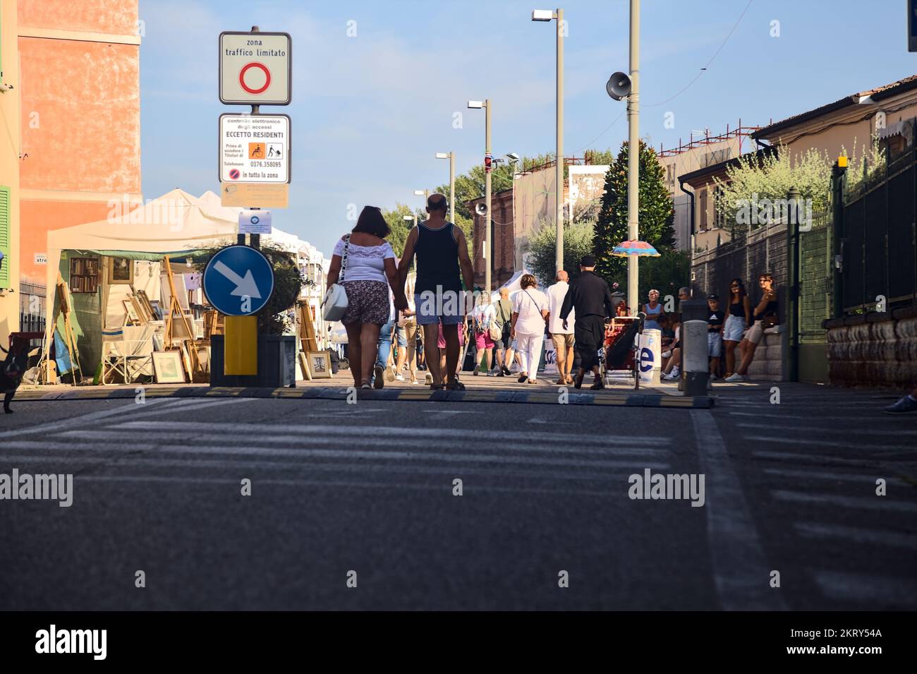 Stalls and crowd of a fair in the italian countryside in summer Stock ...