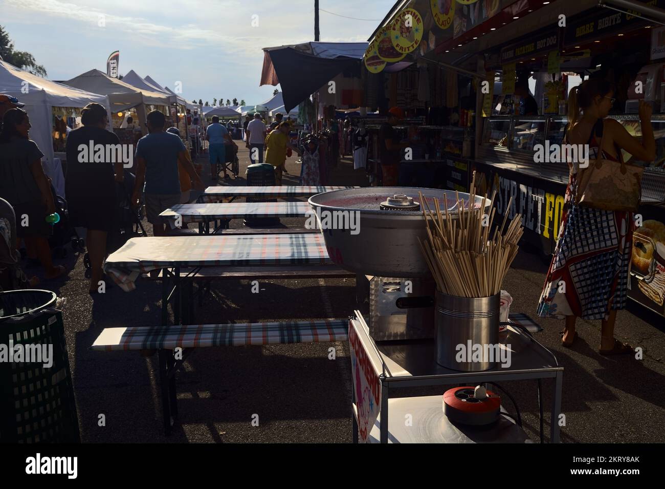 Stalls and crowd of a fair in the italian countryside in summer Stock ...