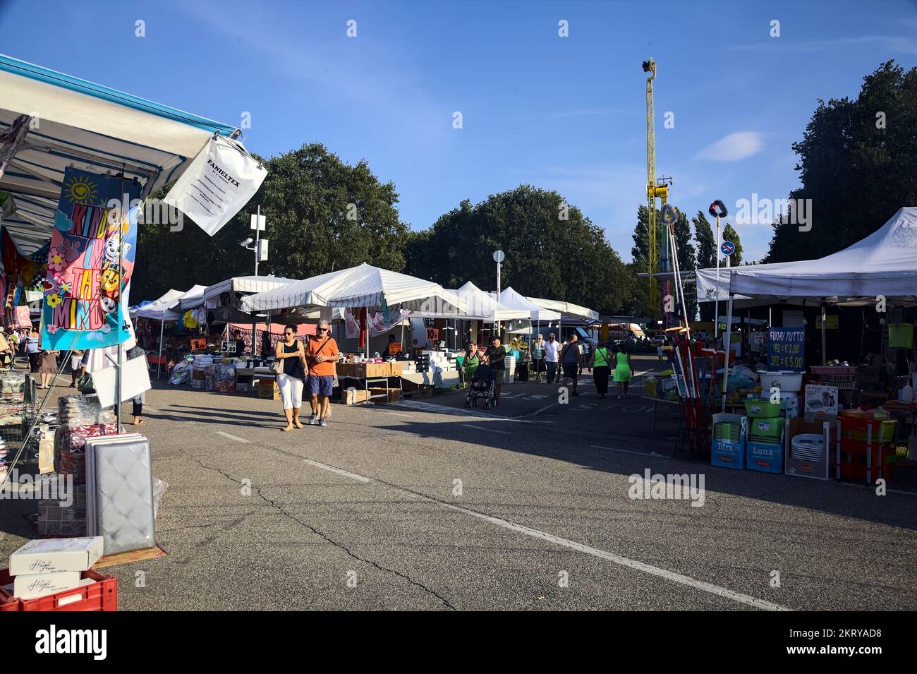Stalls and crowd of a fair in the italian countryside in summer Stock ...