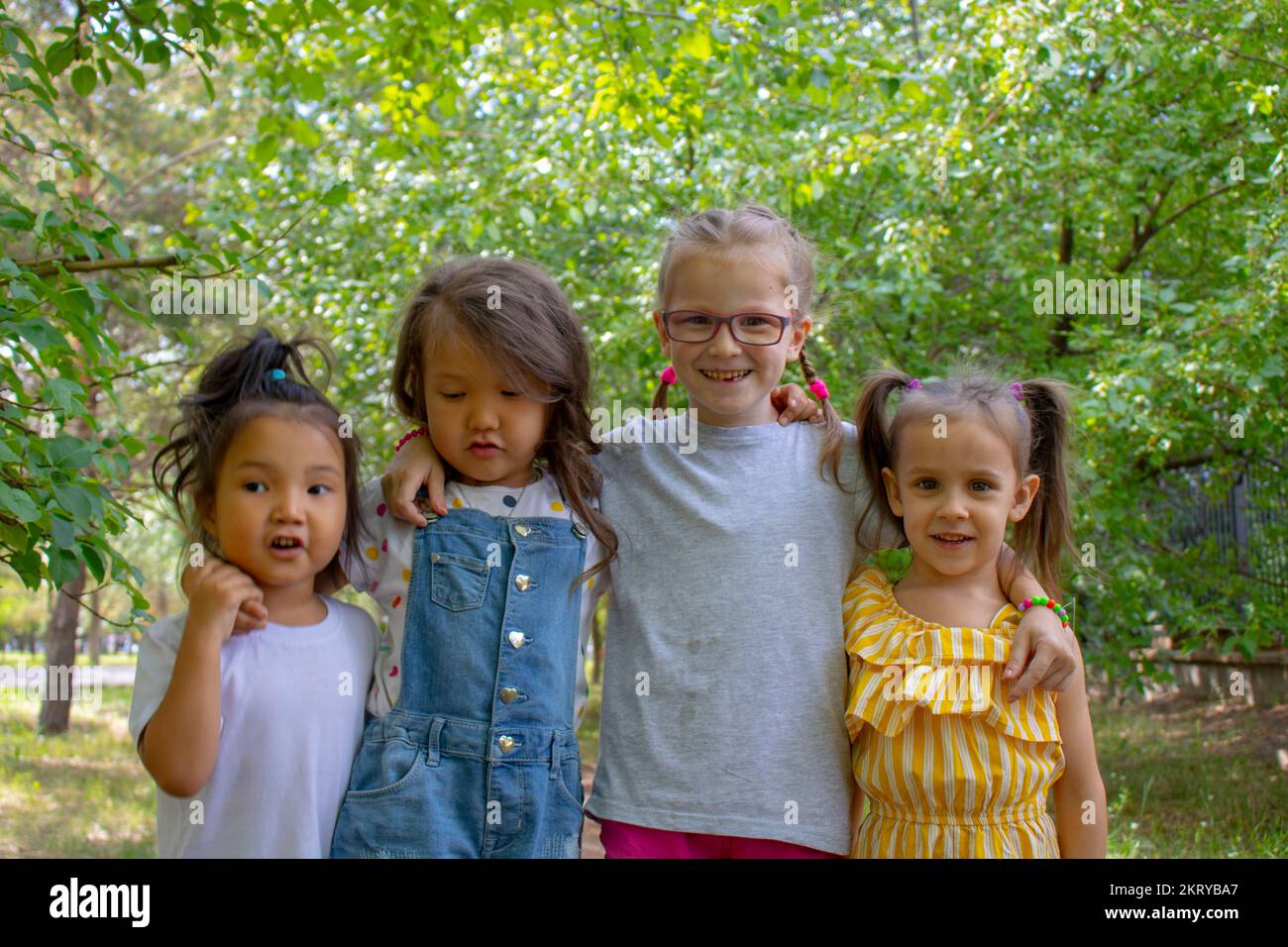 Four sisters hugging and talking each other Stock Photo - Alamy