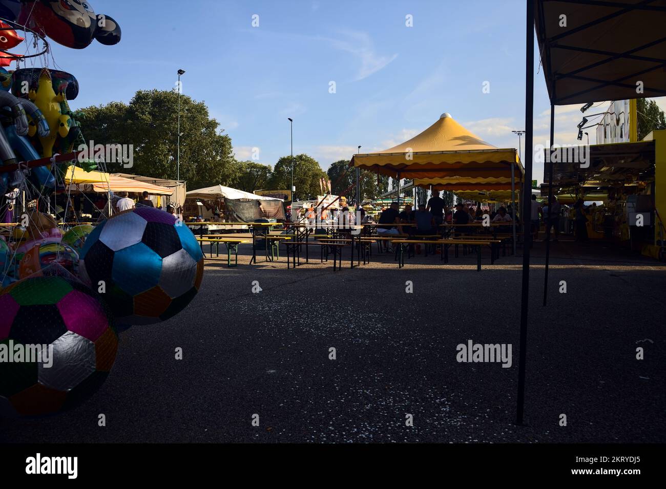 Stalls and crowd of a fair in the italian countryside in summer Stock ...