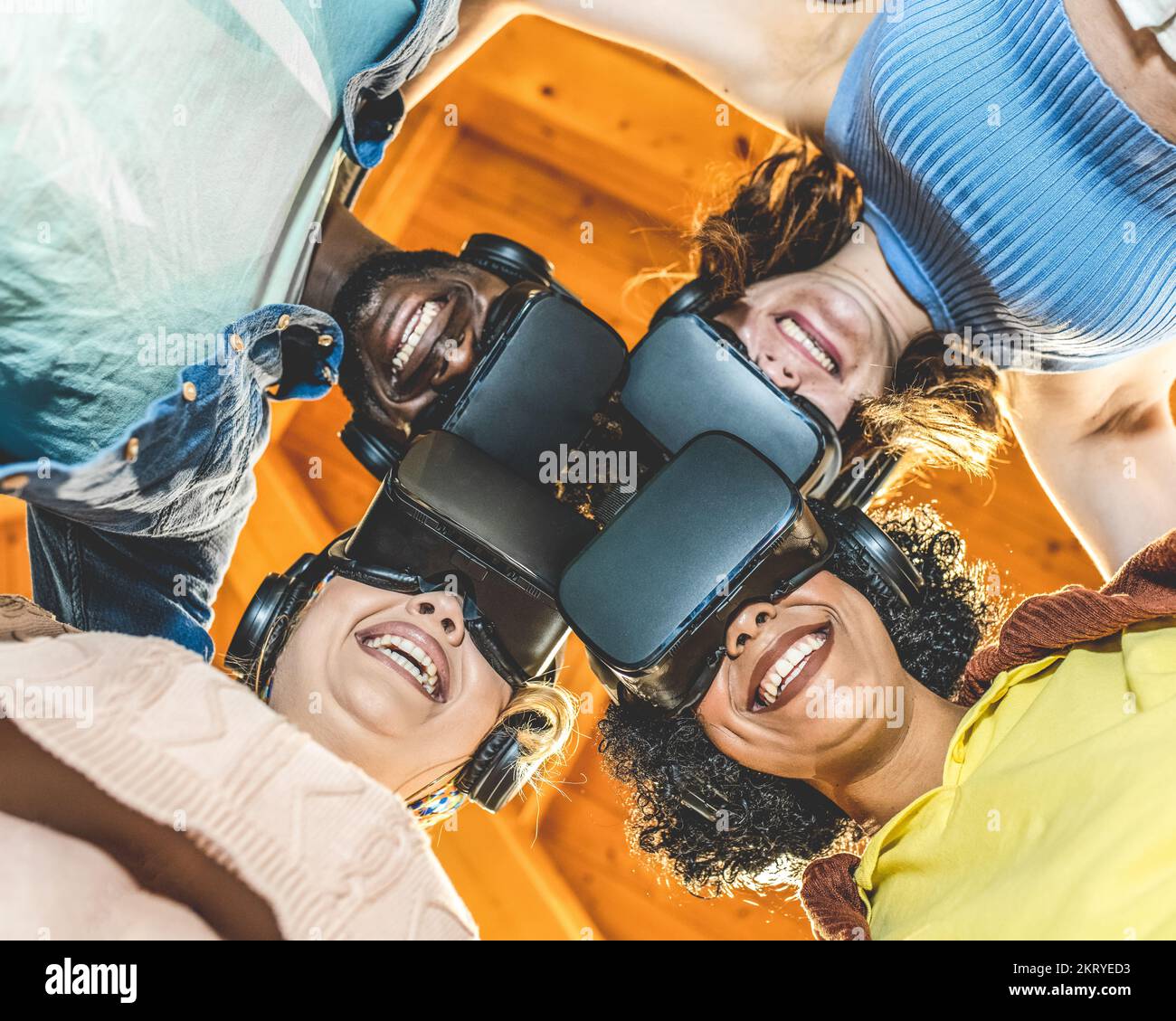 Portrait from below of a team of online players with augmented reality ...