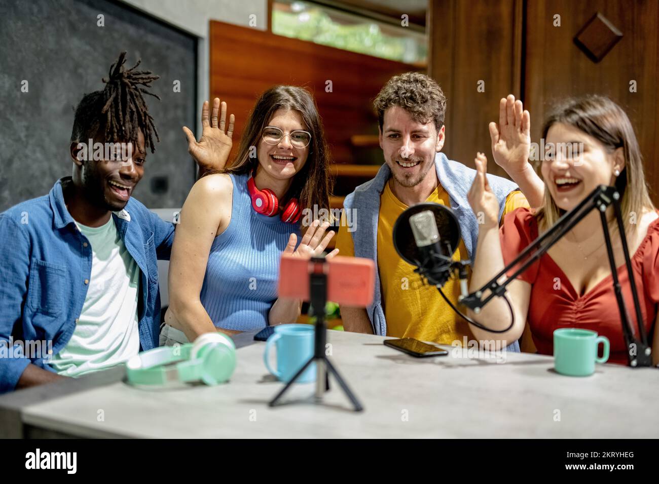 moment of greetings during a broadcast of video influencers, four young ...