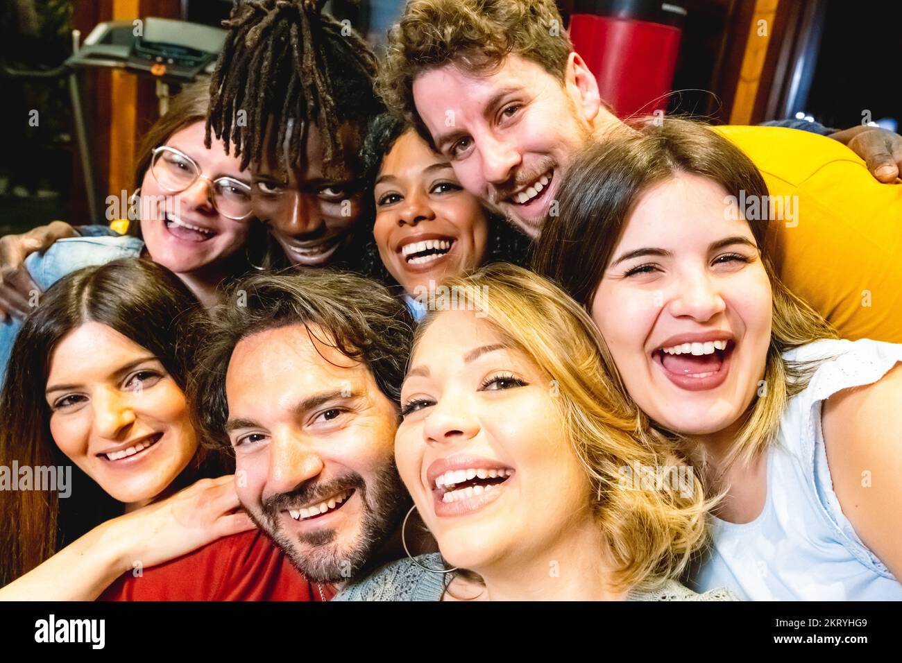 Selfie of large group of people, many people around a woman taking a ...