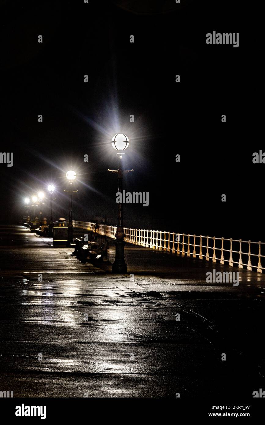 The promenade along Whitby pier at night Stock Photo - Alamy