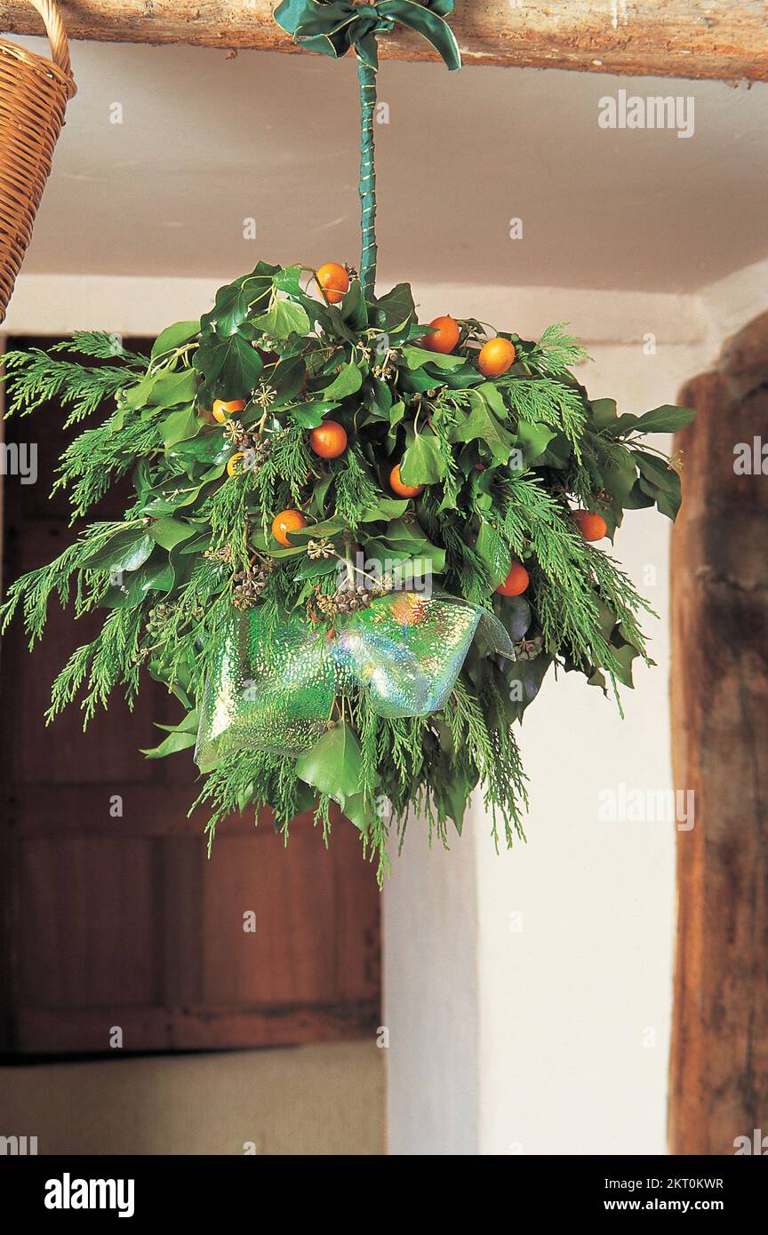 A kissing ring hanging from a wooden beam Stock Photo - Alamy