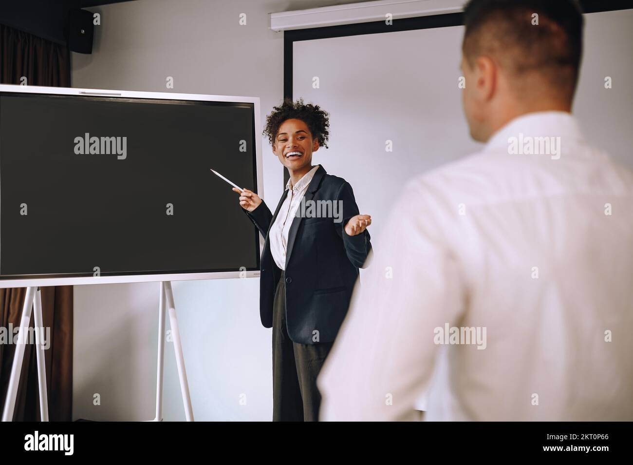 Woman watching man work hi-res stock photography and images - Alamy